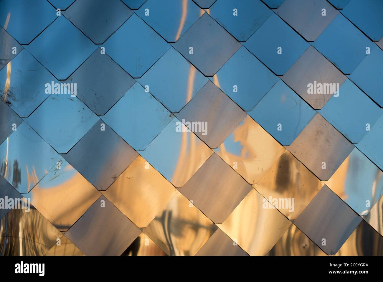 old, dirty aluminum metal wall facade panel with rhombus, similar to ...