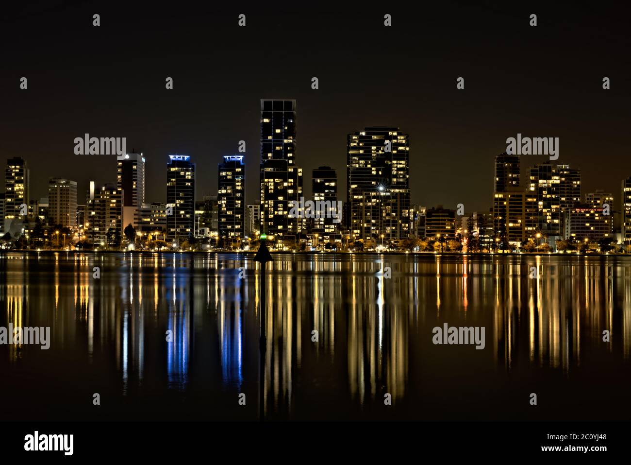 The Skyline of Perth at night. Reflecting in the svan river with a dark ...