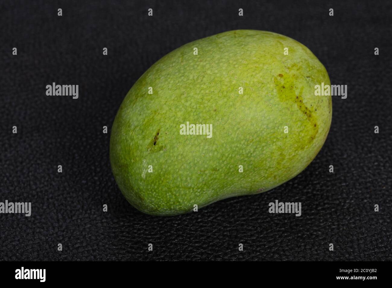 Green tasty mango over background Stock Photo - Alamy