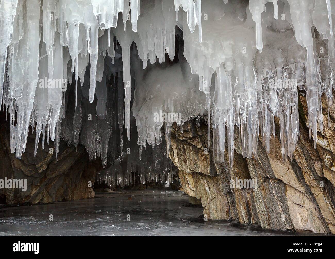 Multicolored stone grotto with icicles Stock Photo - Alamy