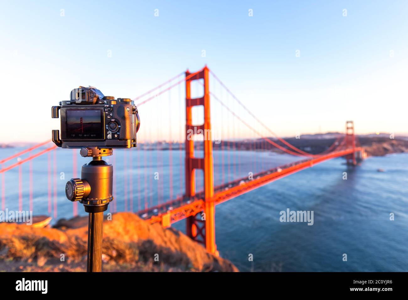 camera with gold gate bridge over water Stock Photo - Alamy