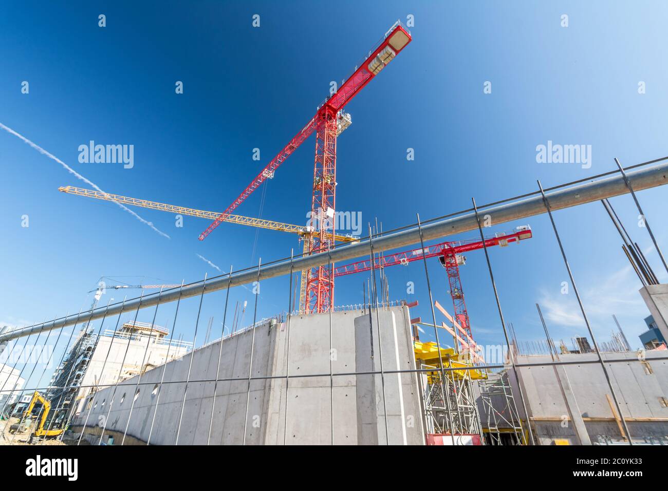 Large construction site with construction fence and cranes Stock Photo ...