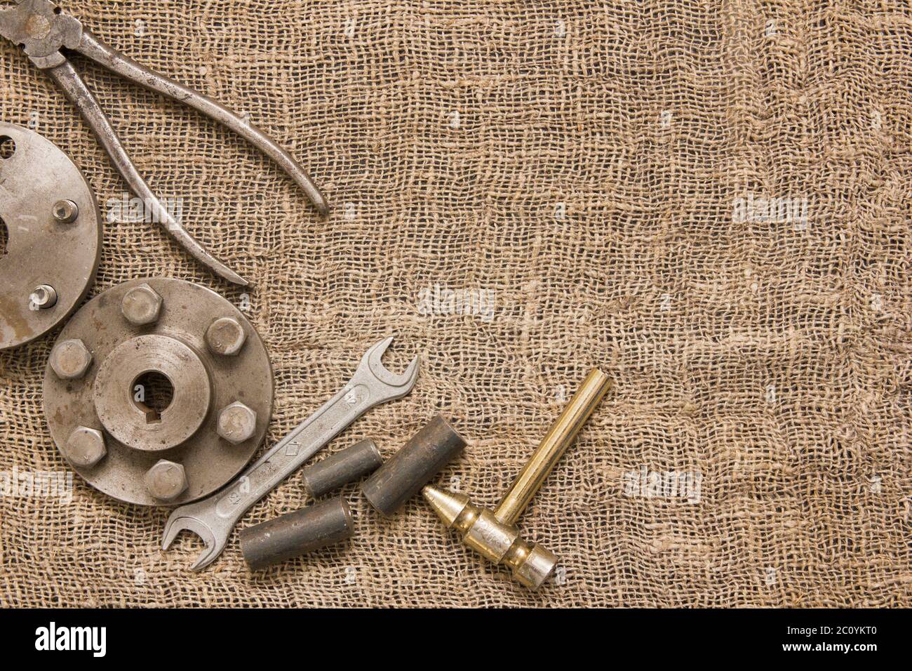 old rusty tools and details on the rough fabric Stock Photo - Alamy