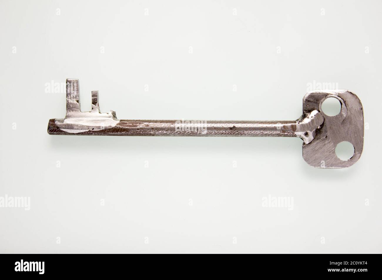 Old rusty key on white Stock Photo - Alamy