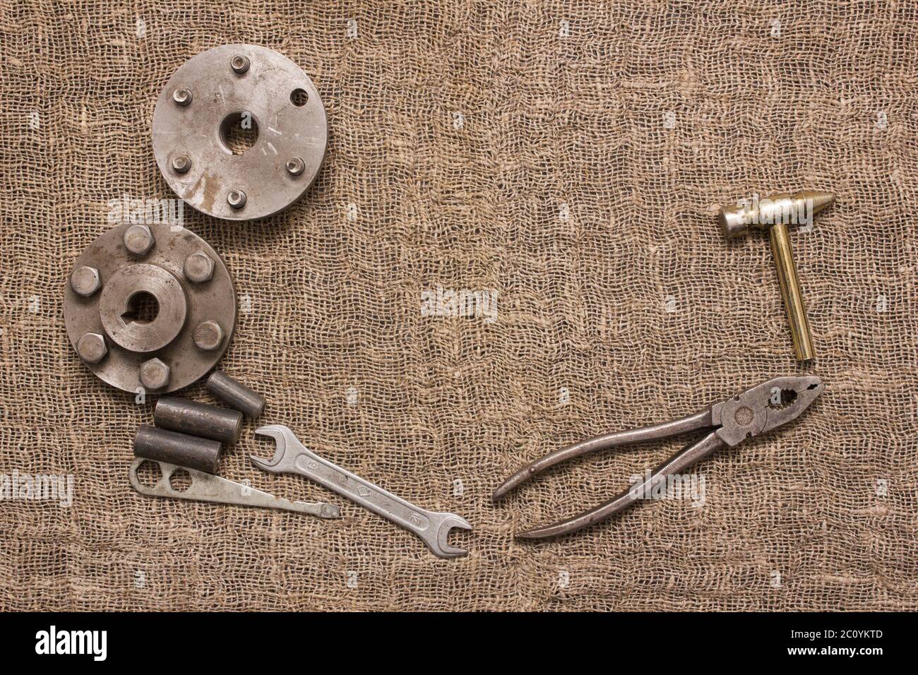 old rusty tools and details on the rough fabric Stock Photo - Alamy