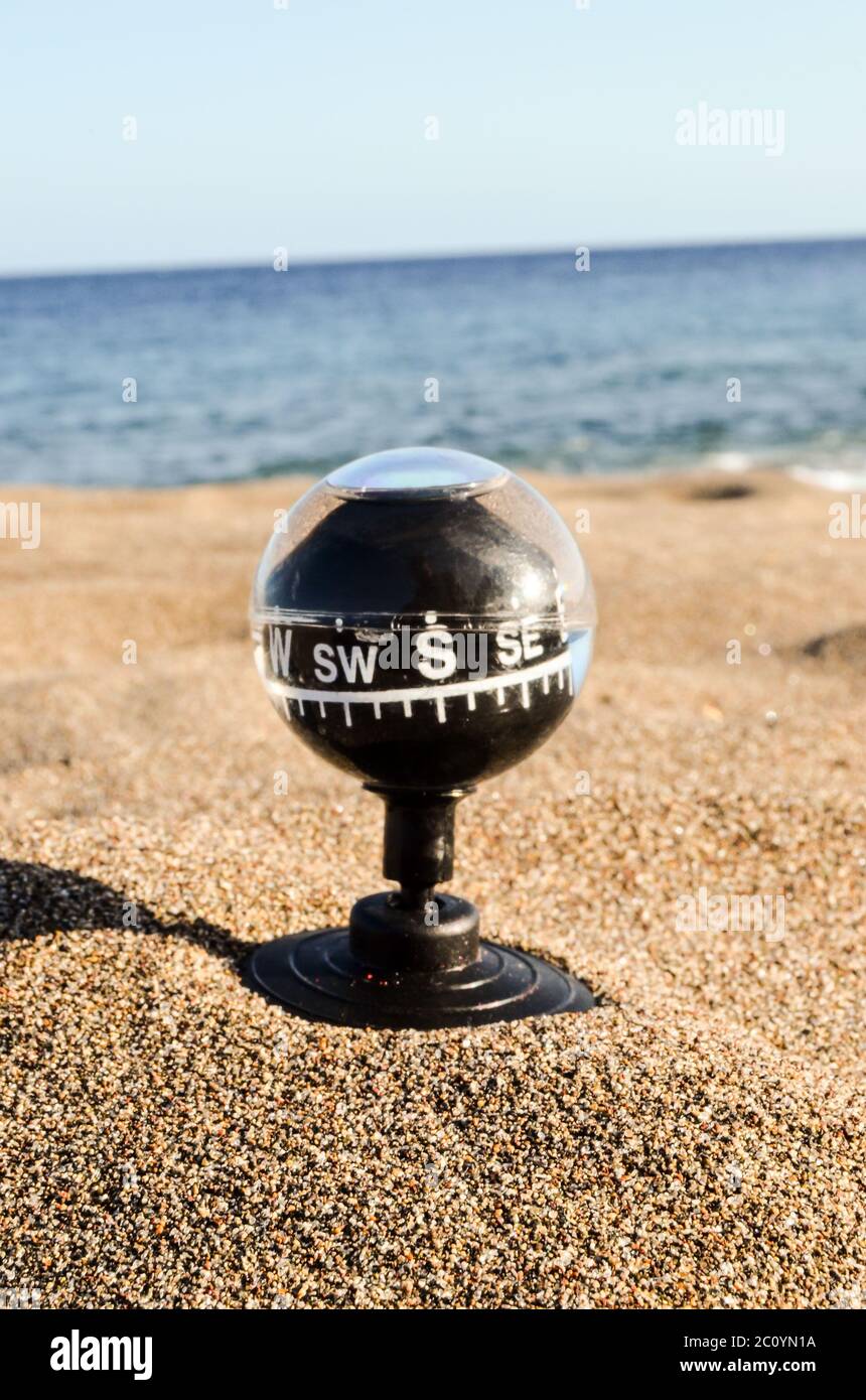 Compass on the Sand Beach Stock Photo - Alamy