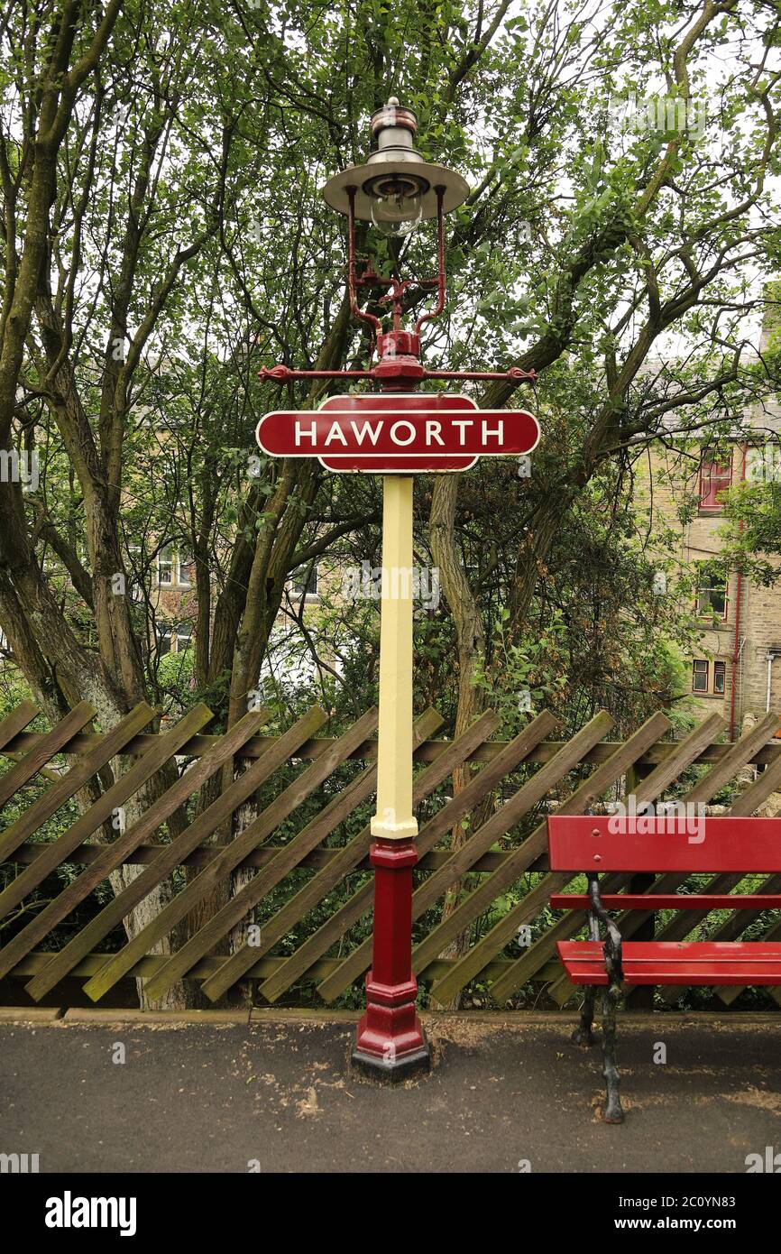 A destination sign mounted on a traditional railway station lantern at ...