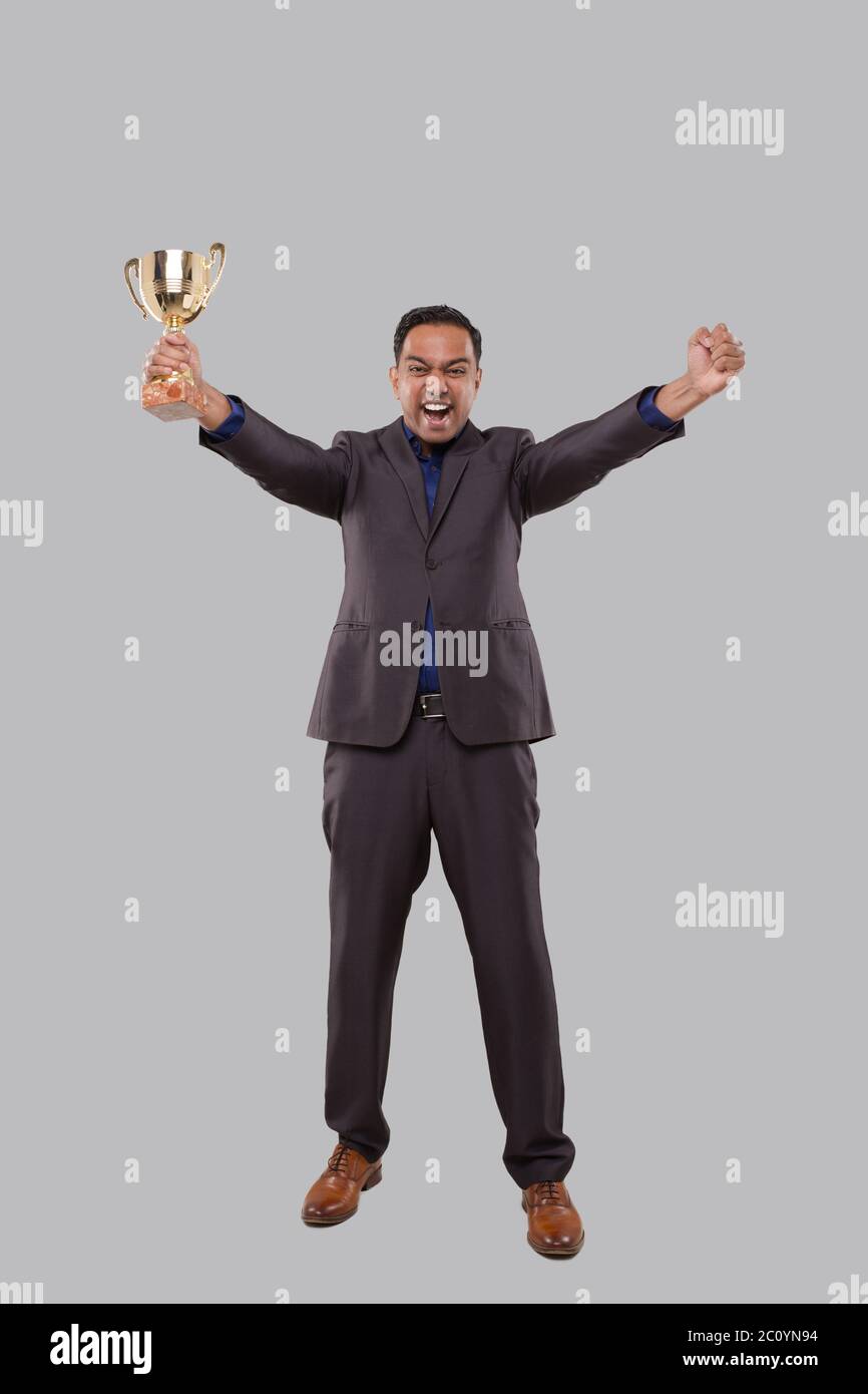 Man excited winning holding hi-res stock photography and images - Alamy