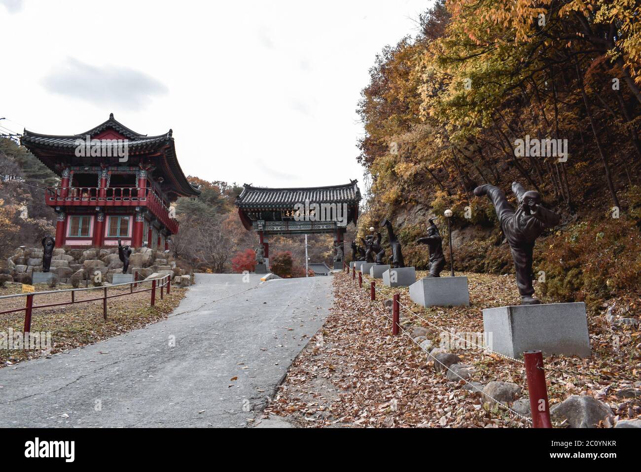 Main entrance to Golgulsa Temple in South Korea with statues of monks ...