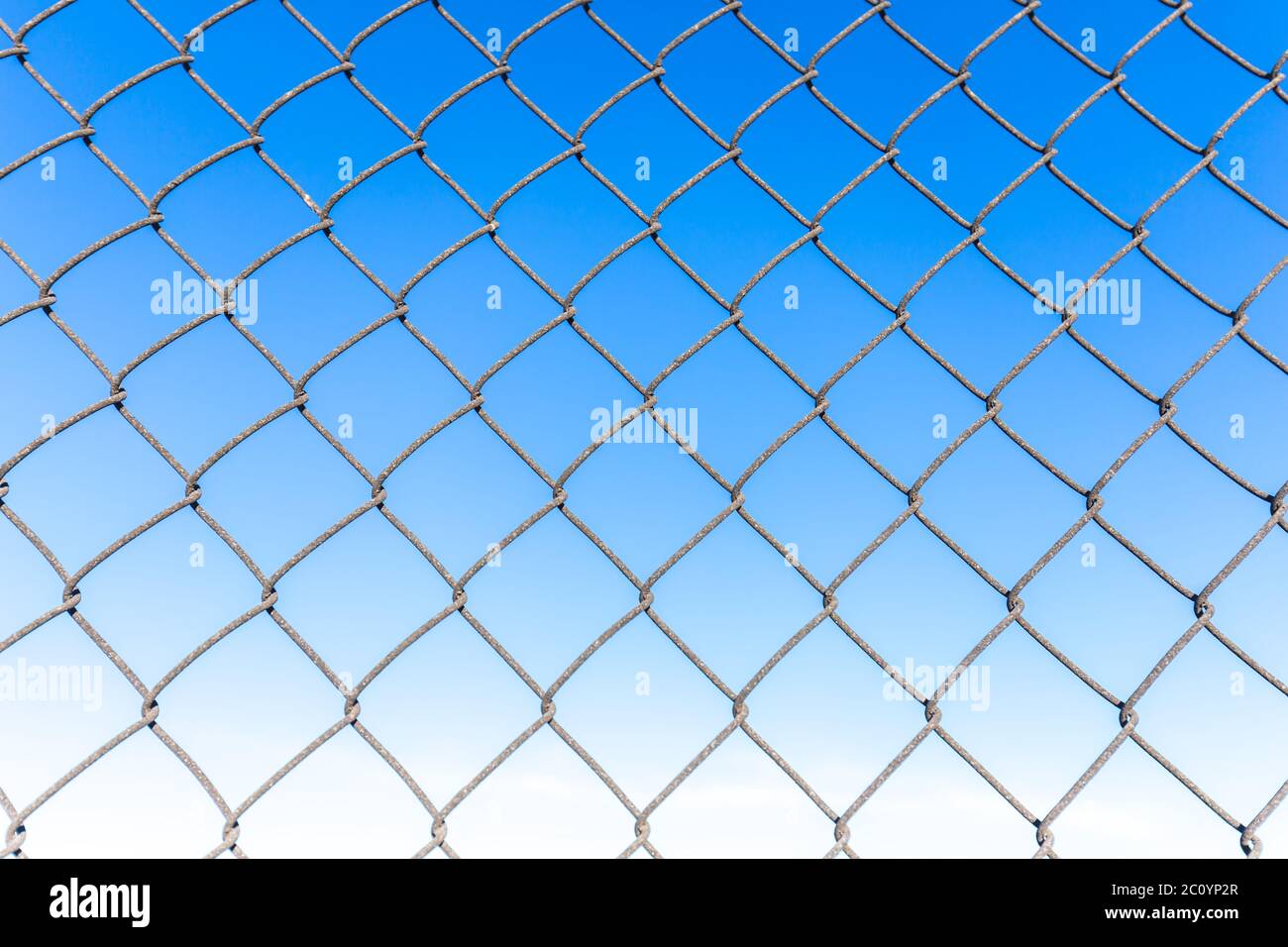 Iron net texture with blue sky background hi-res stock photography and ...