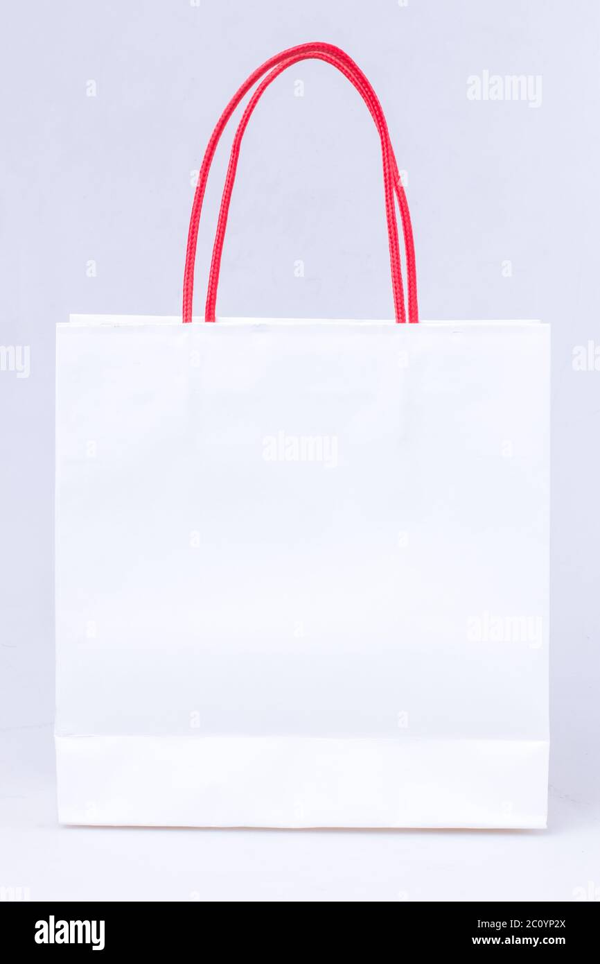 white paper bag with red handle Stock Photo - Alamy