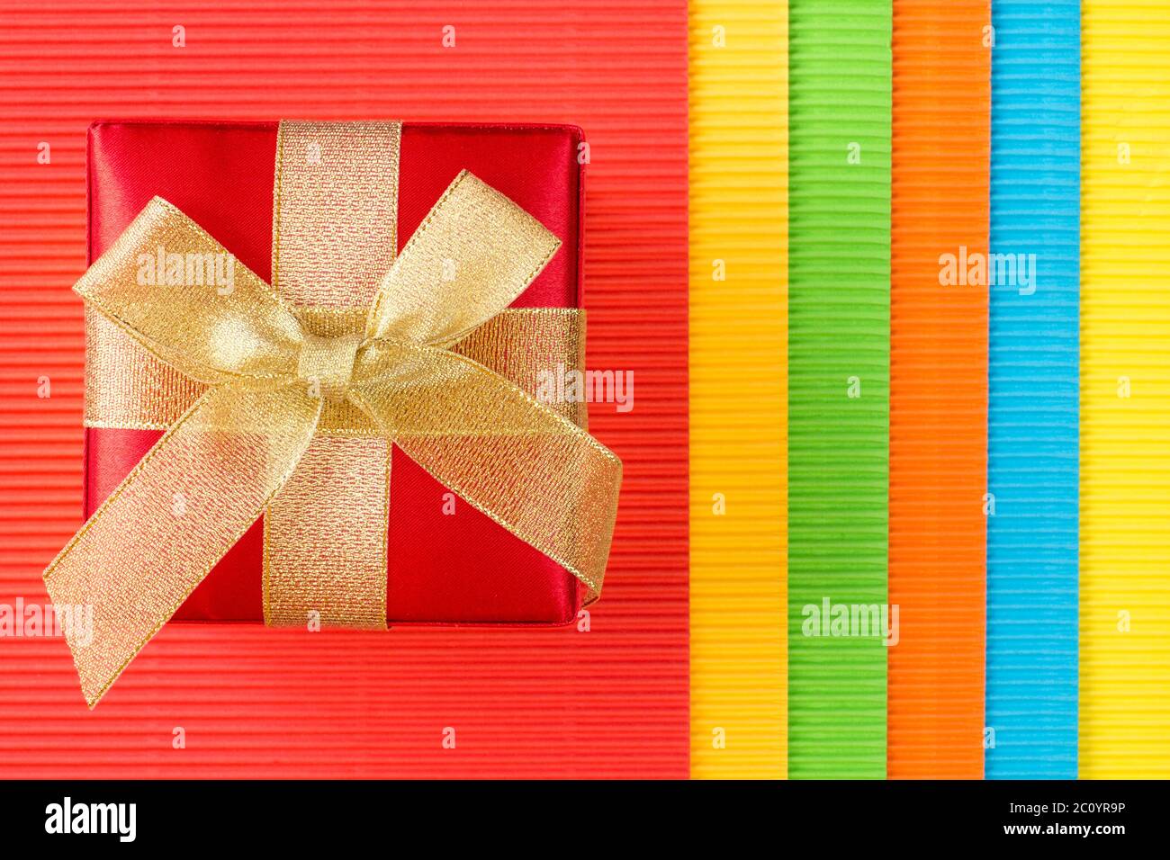 Gift box on colored corrugated paper Stock Photo - Alamy