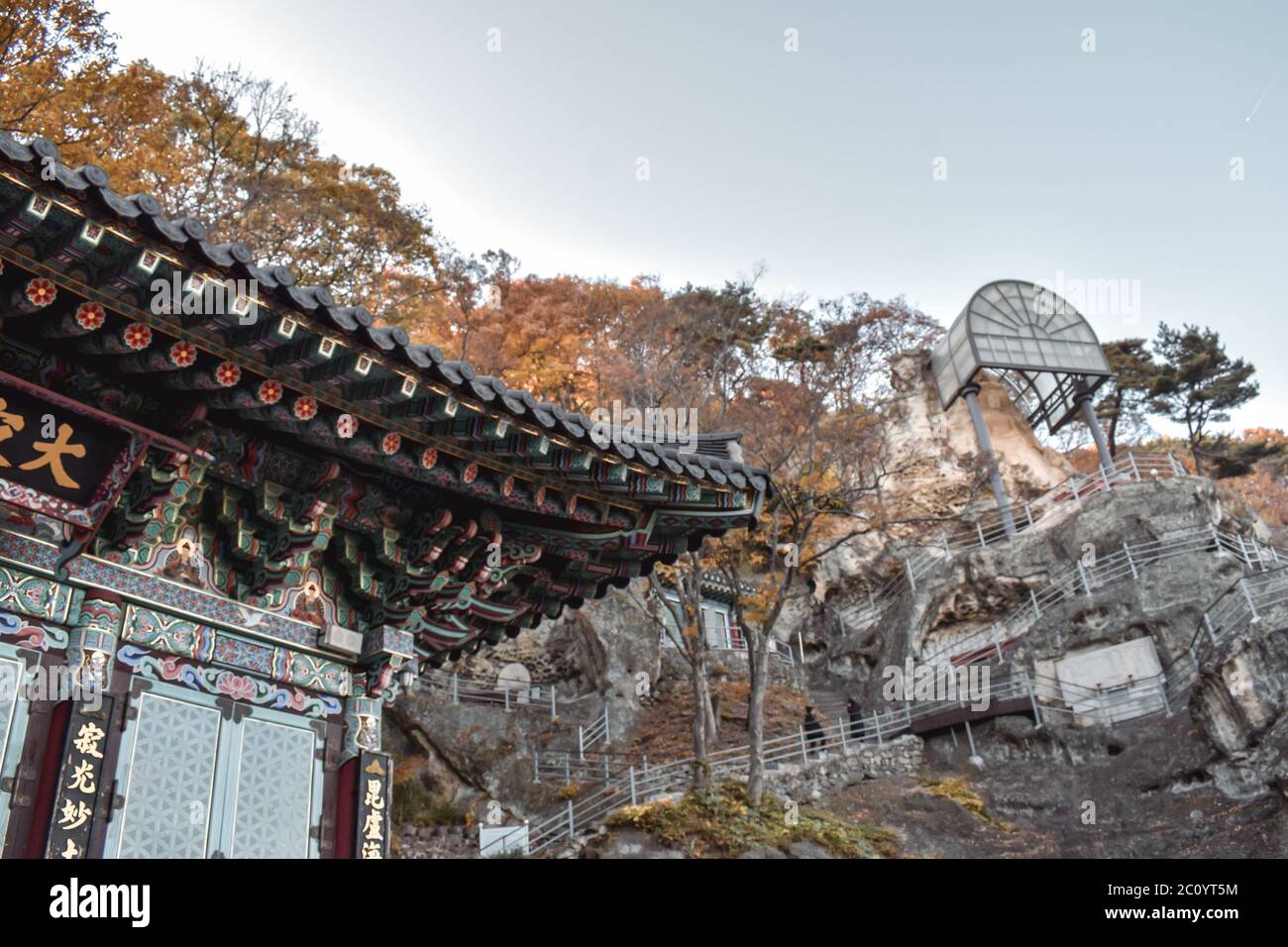 View at the mountain path leading to sitting Buddha engrave in stone in ...