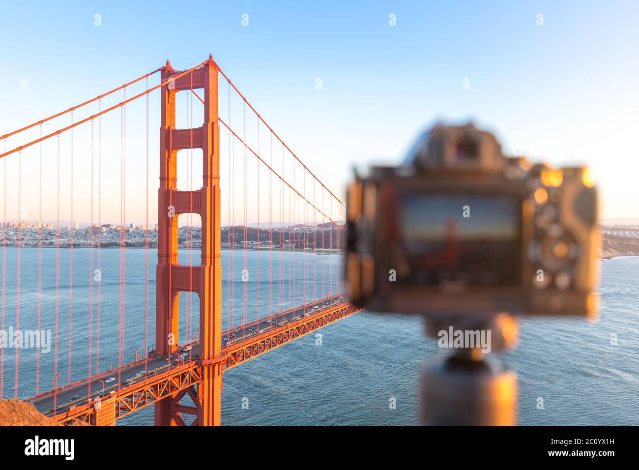 camera with gold gate bridge over water Stock Photo - Alamy