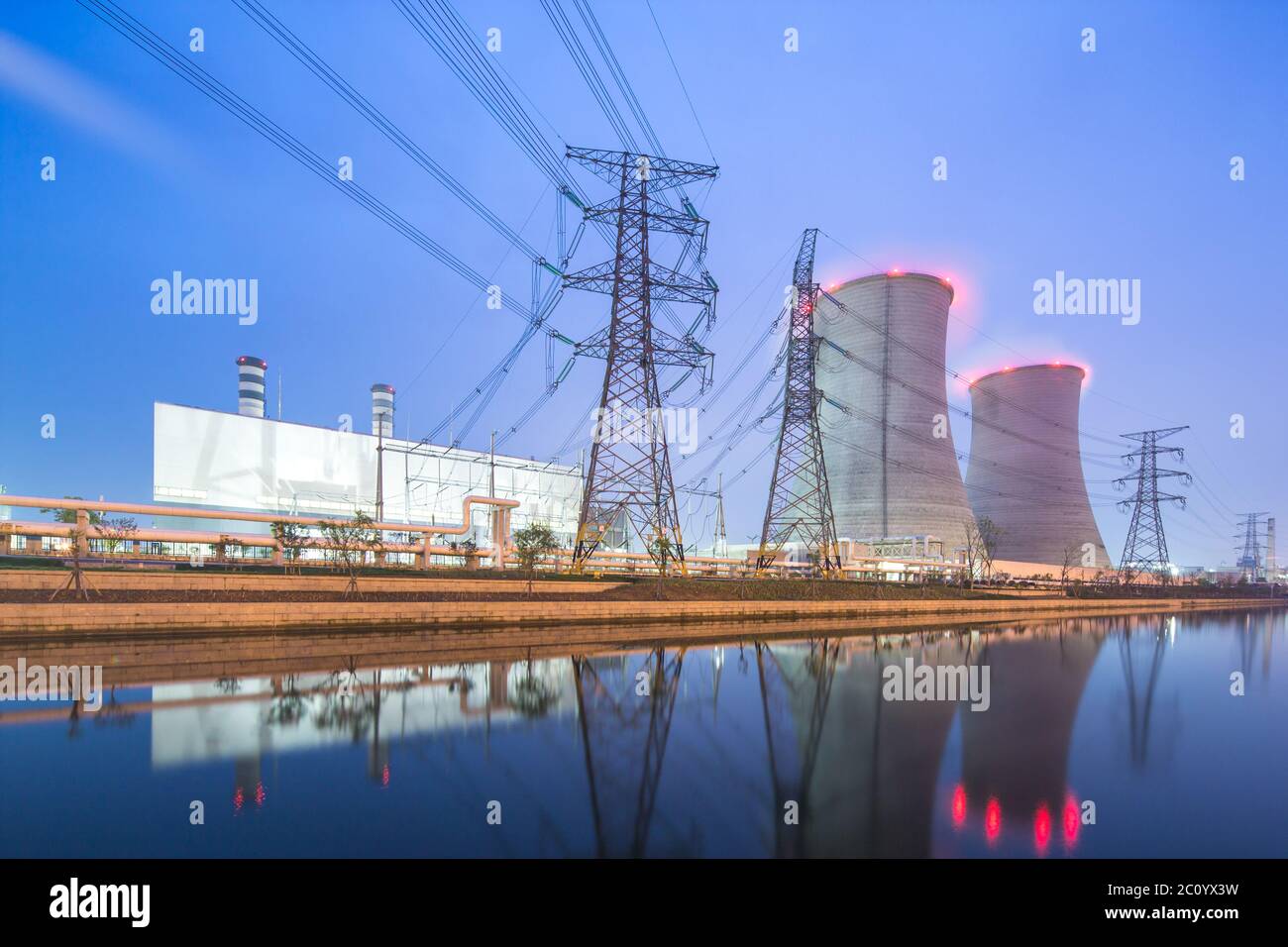 modern factory near river in blue sky at dawn Stock Photo - Alamy