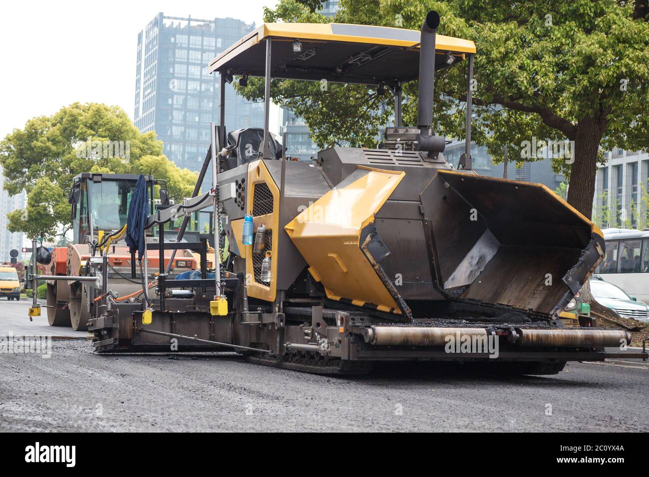 asphalt pavement roller on road Stock Photo - Alamy