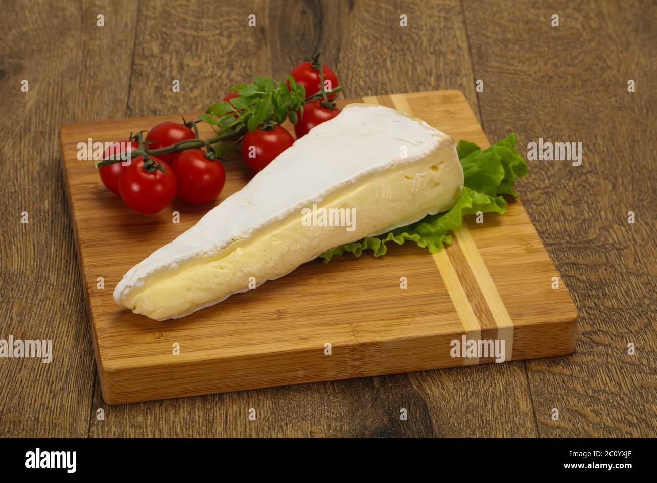 Brie cheese triangle served salad leaves Stock Photo - Alamy