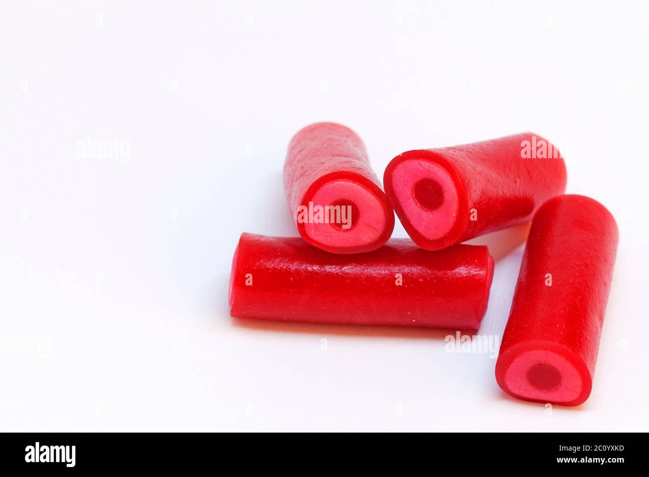 four red candy pieces that are oblong and taste raspberry Stock Photo ...