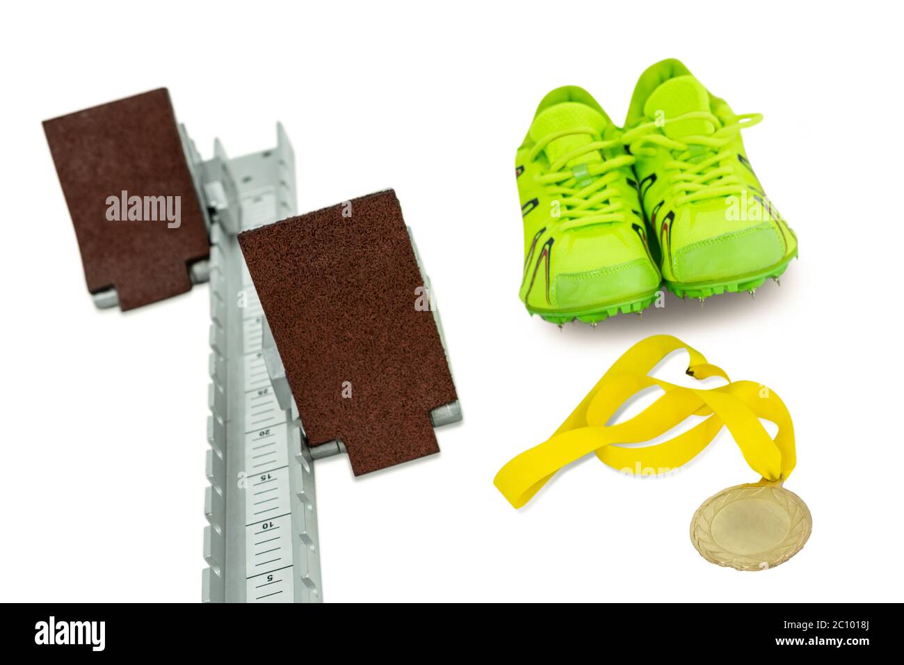 Trainer shoes, starting block and gold medal on white background Stock ...