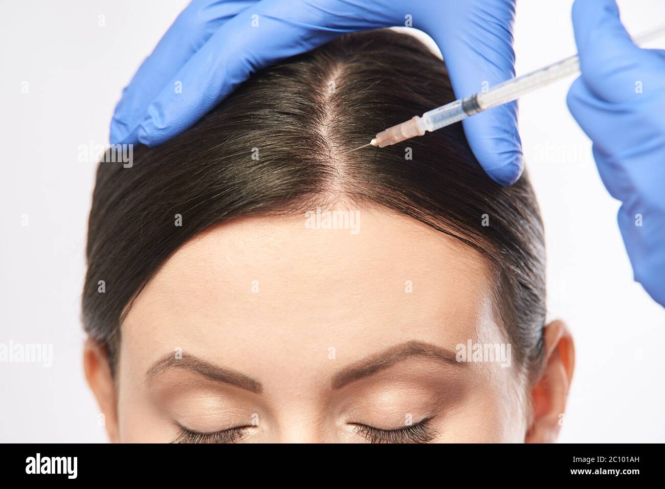 Face needle injection. Young woman cosmetology procedure. Doctor gloves ...