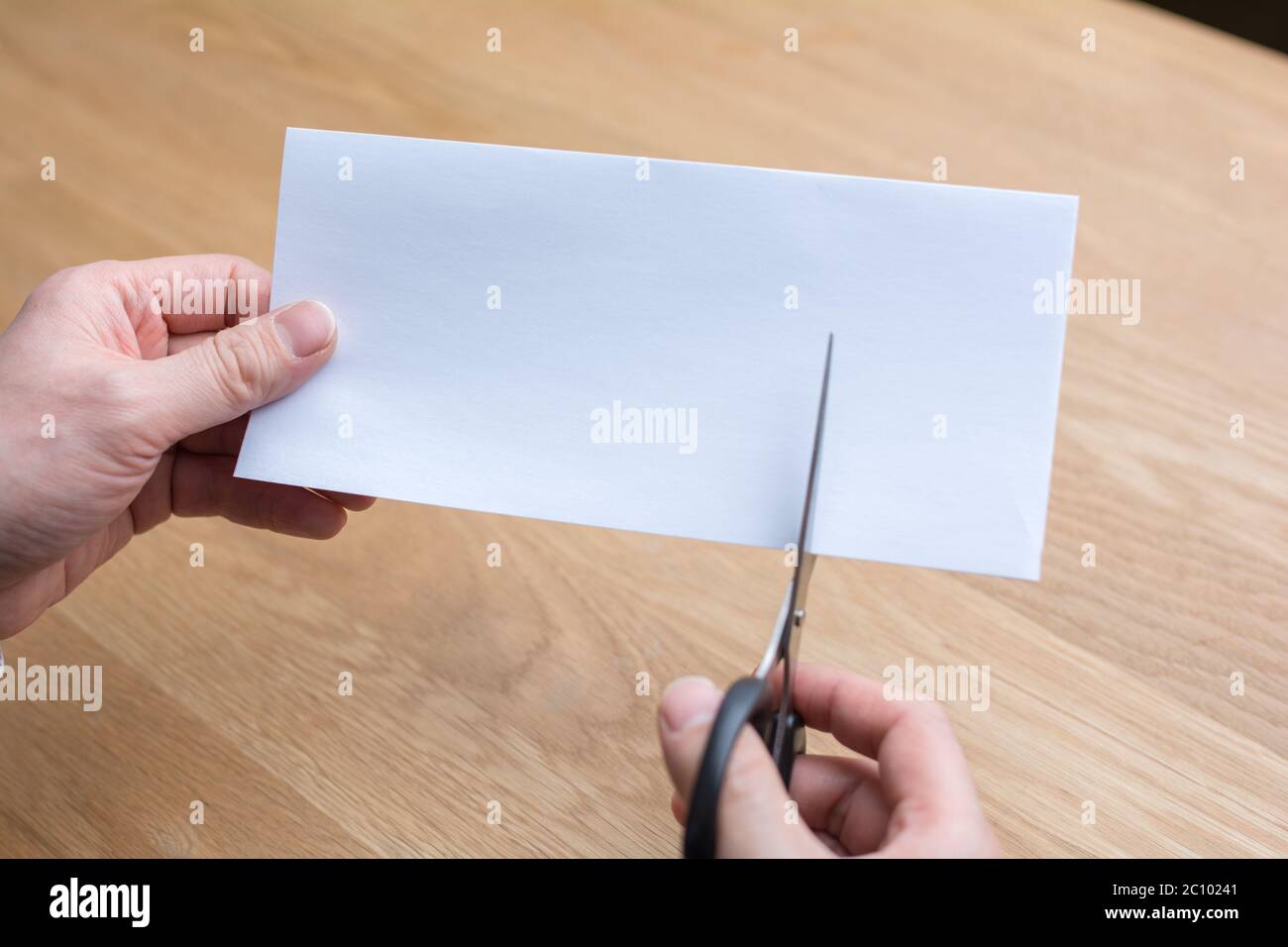 businessman cutting paper by scissors Stock Photo - Alamy