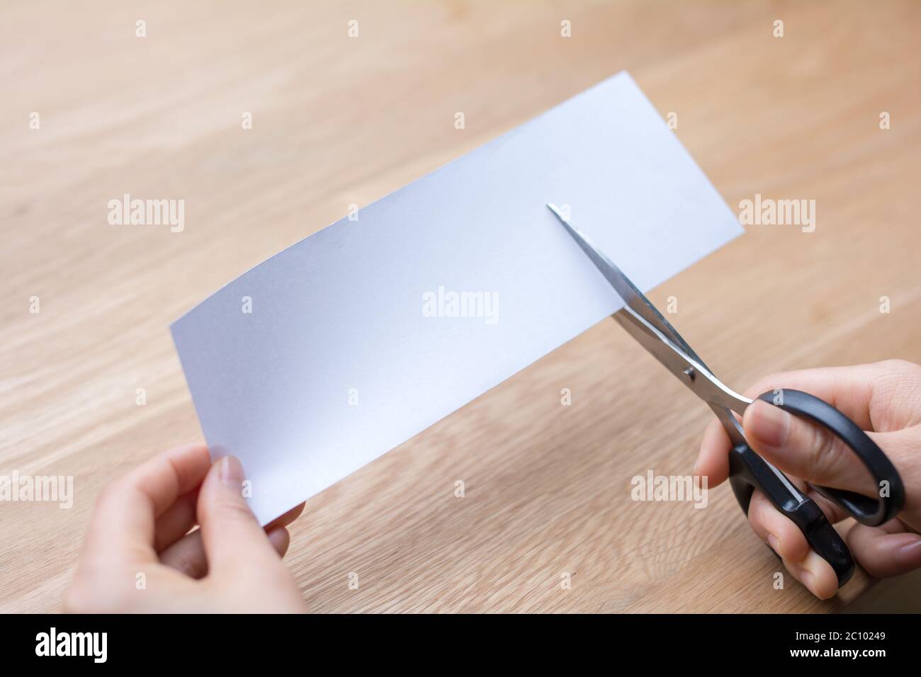 woman cutting white paper Stock Photo - Alamy