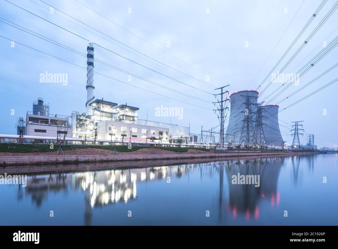 modern factory near river in blue sky at dawn Stock Photo - Alamy