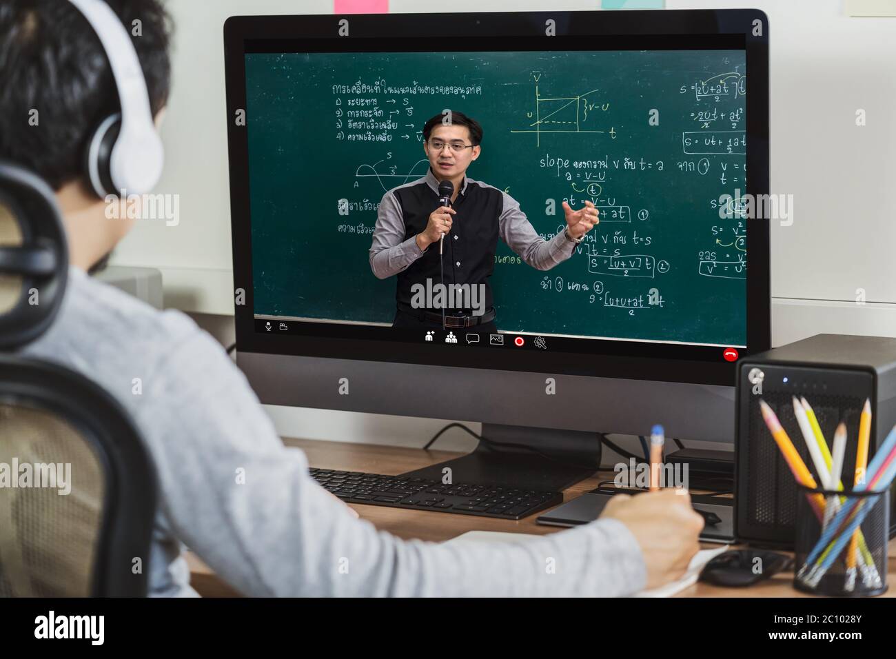 Rear View of Asian student learning with teacher over the physics ...