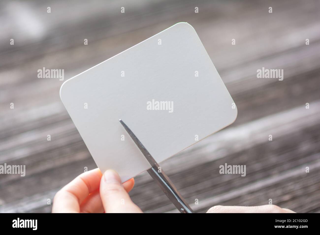 woman cutting paper by scissors Stock Photo - Alamy