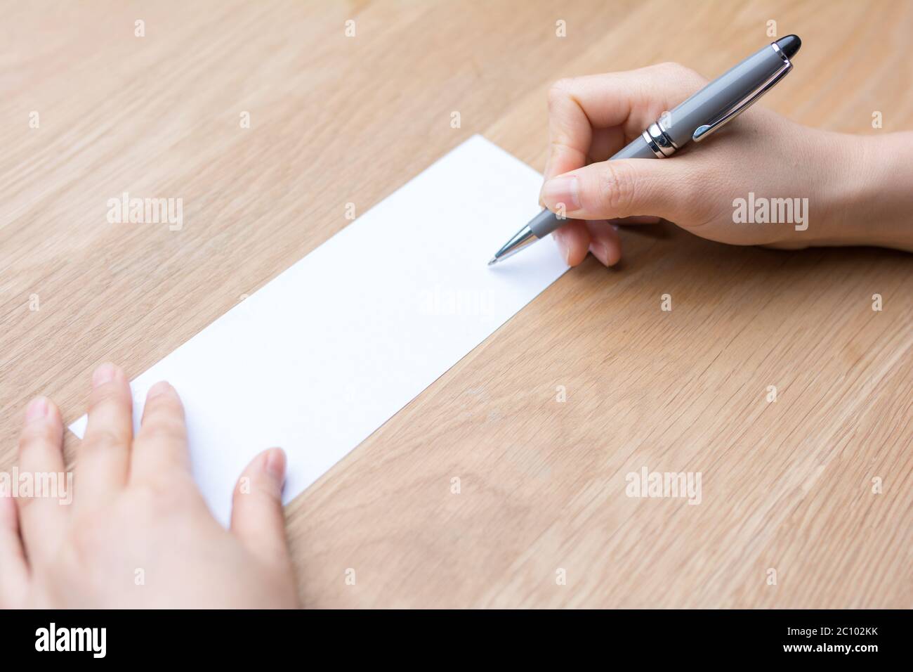 businessman writing on white paper Stock Photo - Alamy