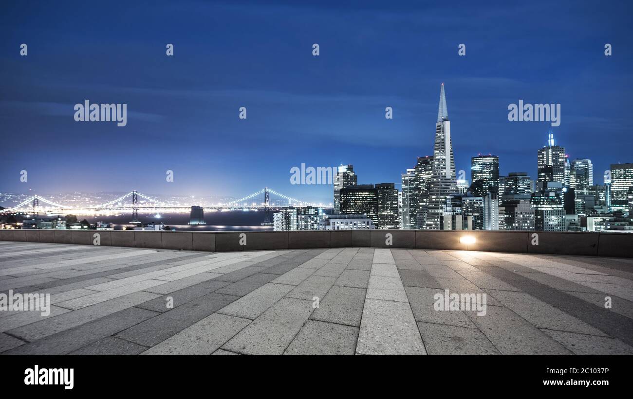 empty pavement with cityscape and skyline of san francisco at twilight ...