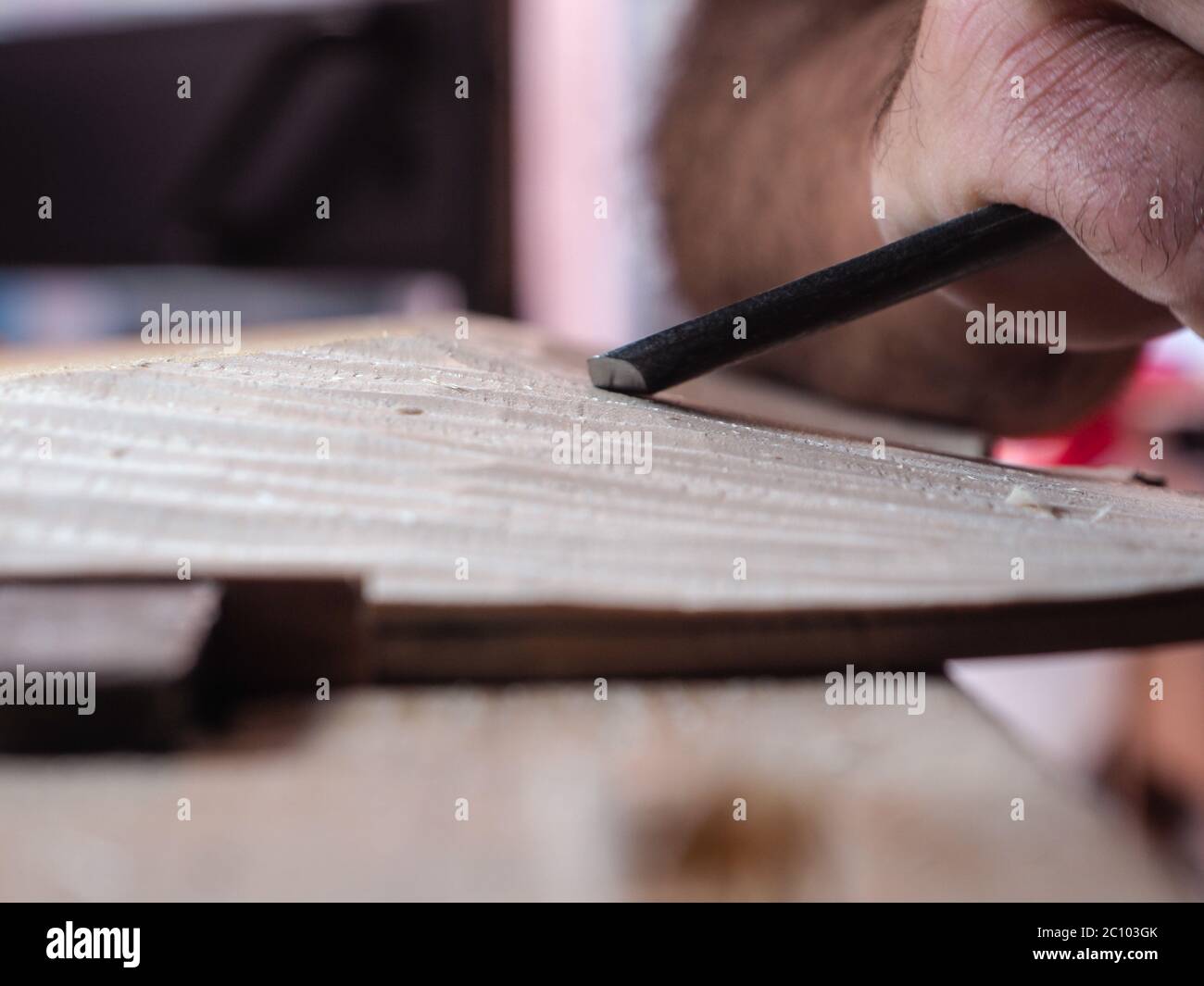 Professional luthier violinmaker artisan working on making a handmade ...