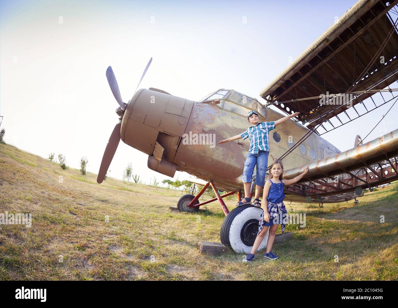 Little boy and little girl pilot near the retro airplane Stock Photo ...