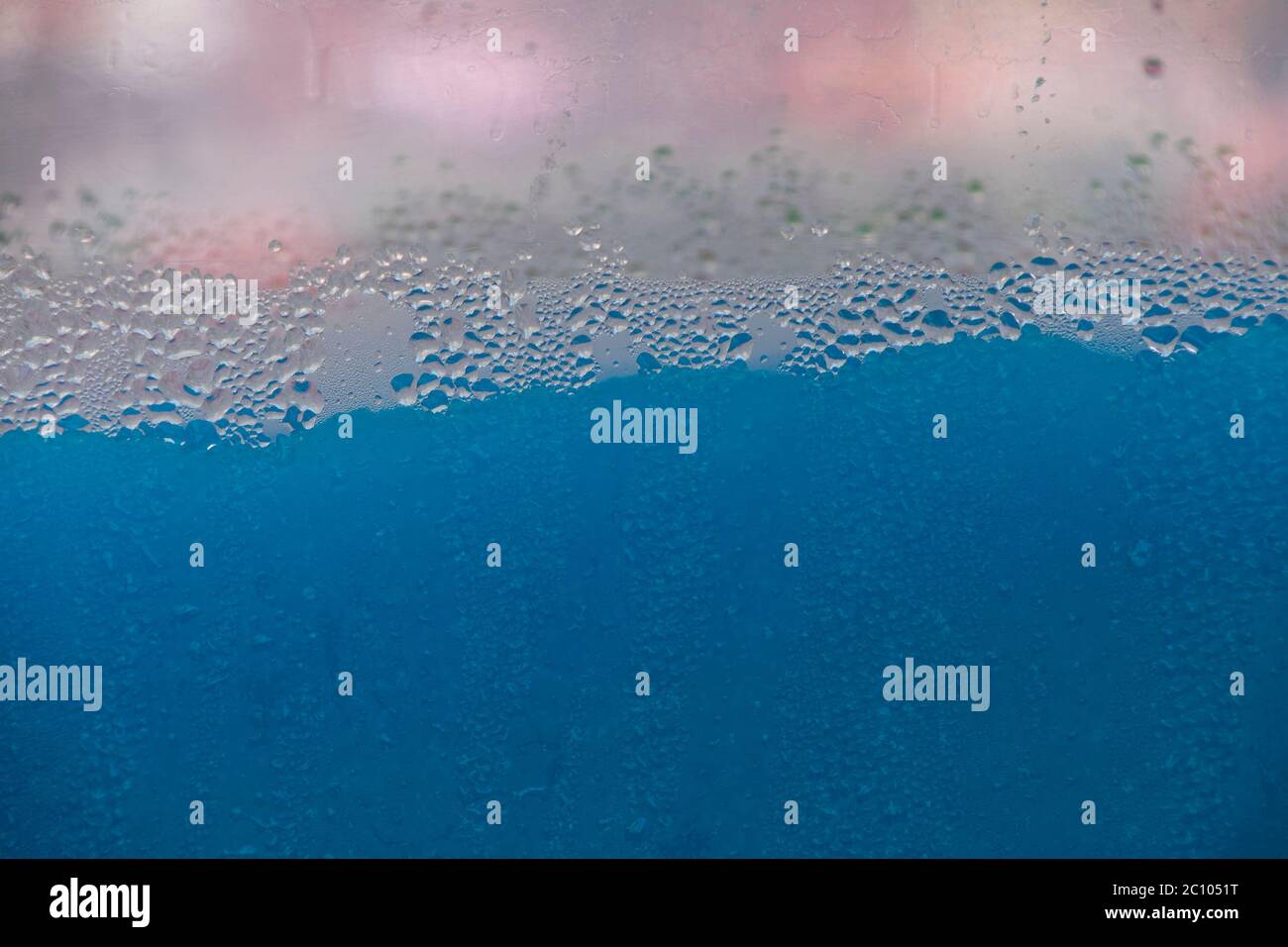 Close up background of blue slush ice smoothie drink in machine ...