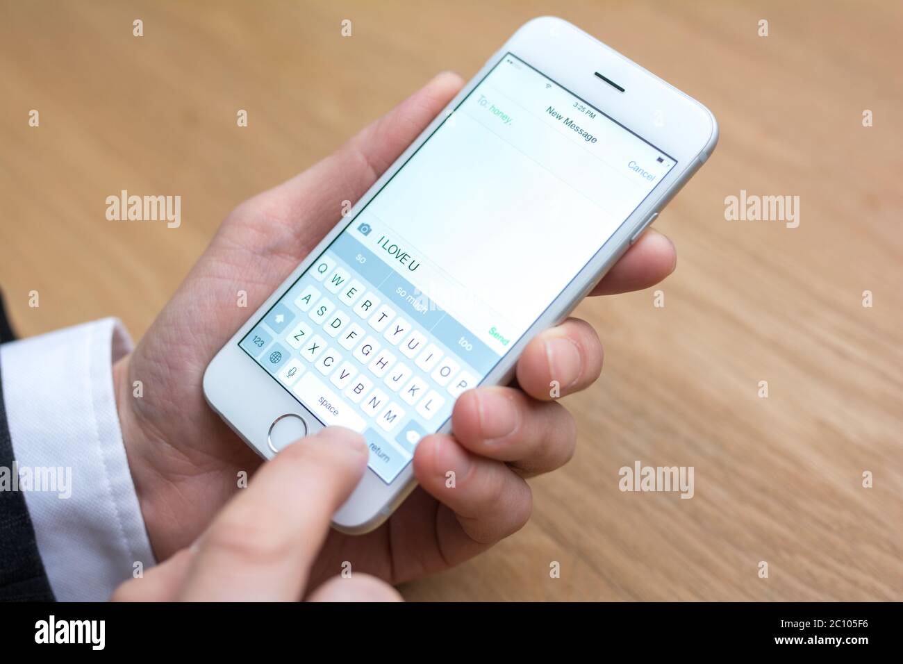 businessman edits message on mobile phone Stock Photo - Alamy