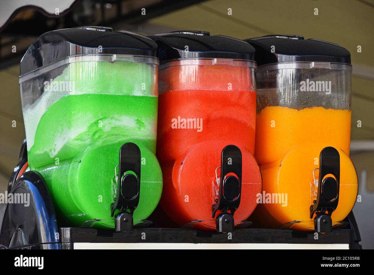 Close up green, red and orange slush ice Granita smoothie drinks in ...