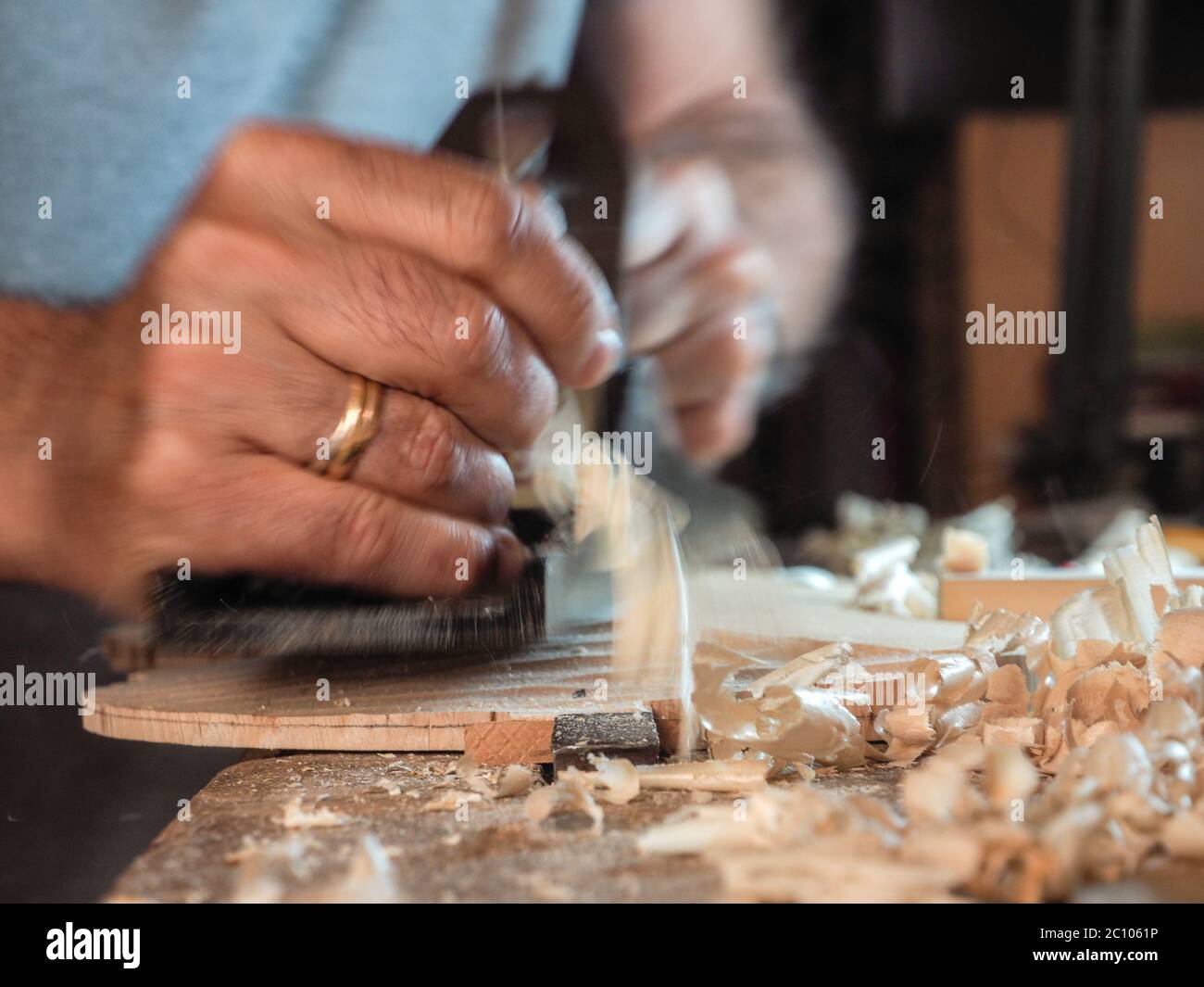 Professional luthier violinmaker artisan working on making a handmade ...