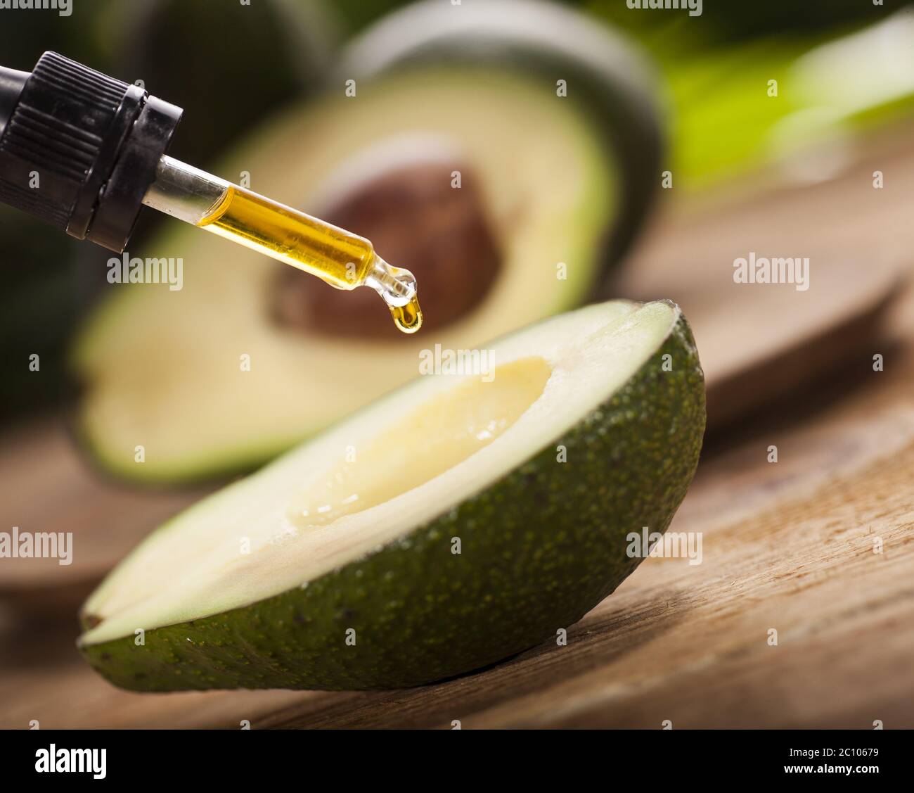 Half avocado fruit oil hi-res stock photography and images - Alamy