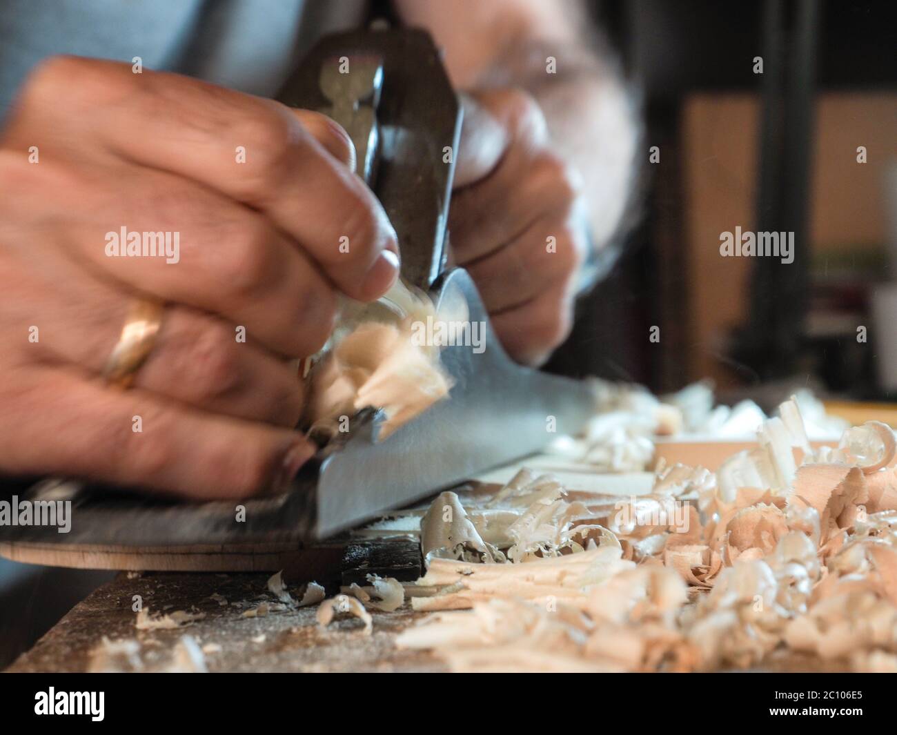 Professional luthier violinmaker artisan working on making a handmade ...