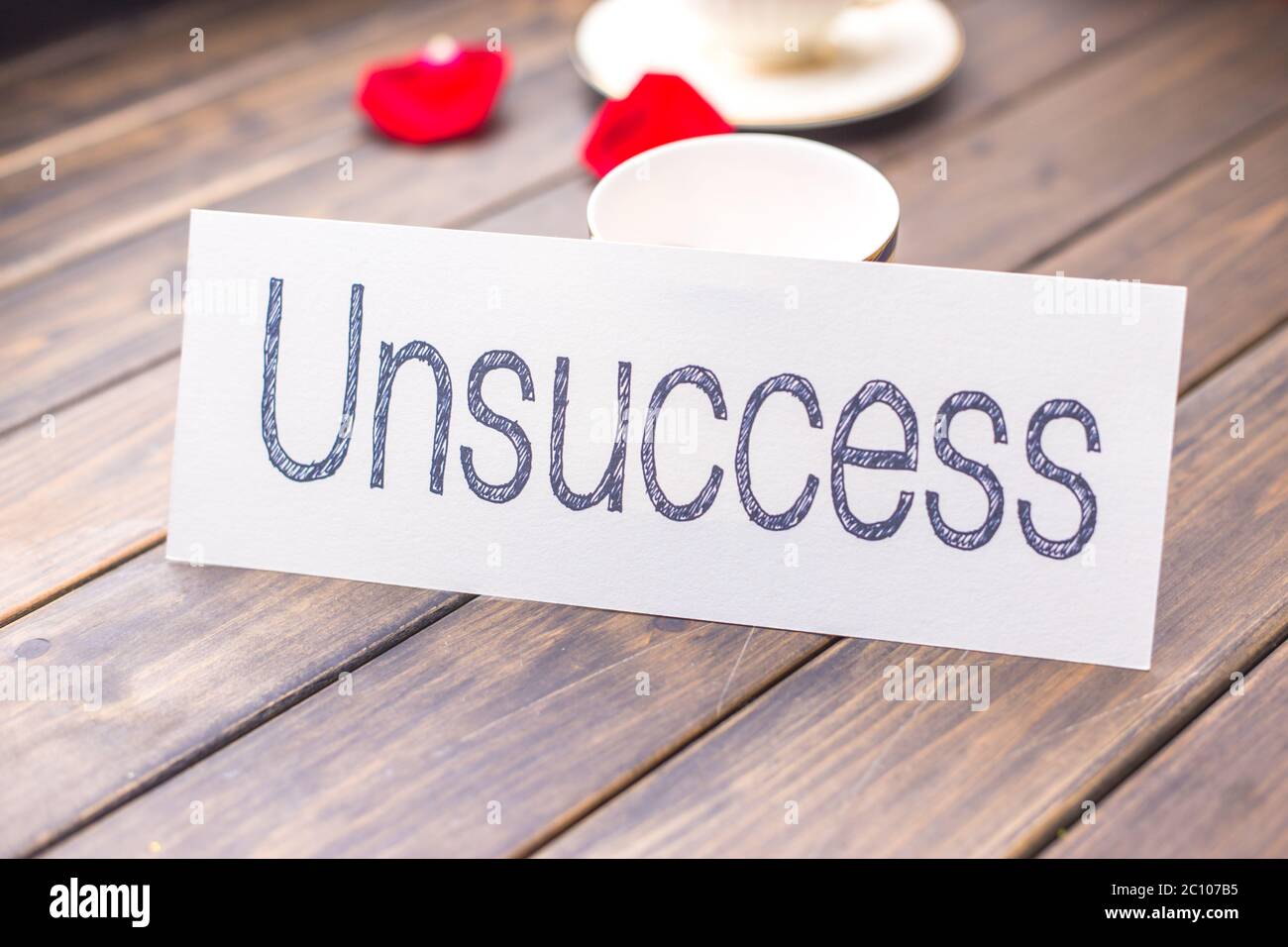 unsuccess to success on white paper Stock Photo - Alamy