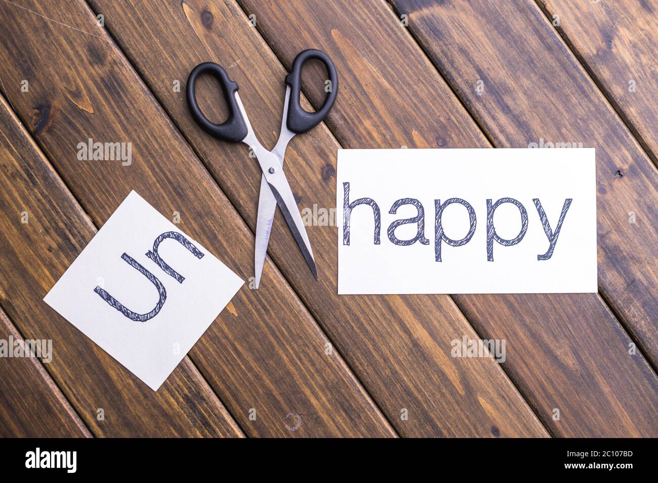 cut paper with word unhappy Stock Photo - Alamy