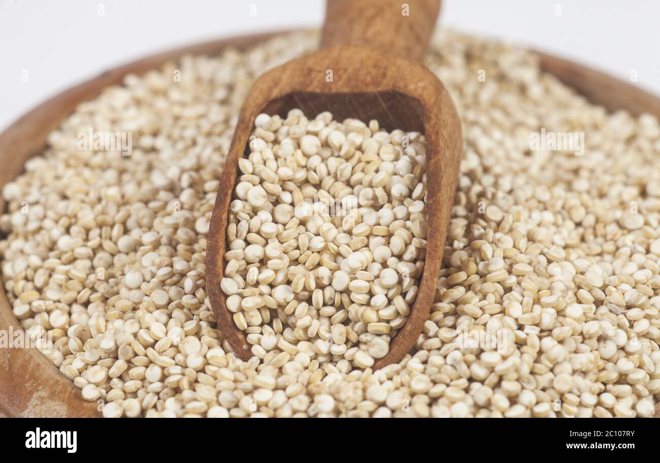 Quinoa on white background Stock Photo - Alamy