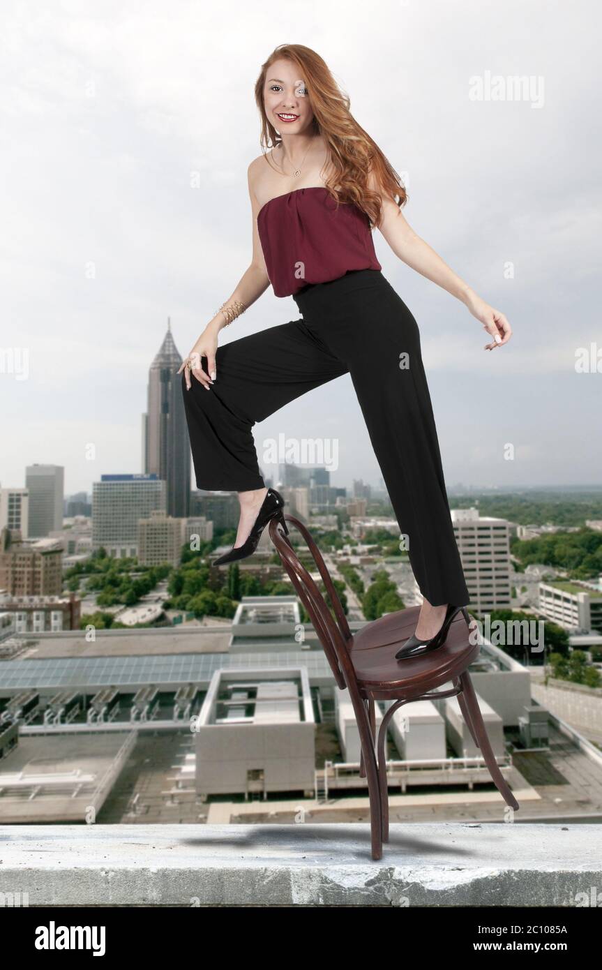 Standing on a chair dangerous hi-res stock photography and images - Alamy