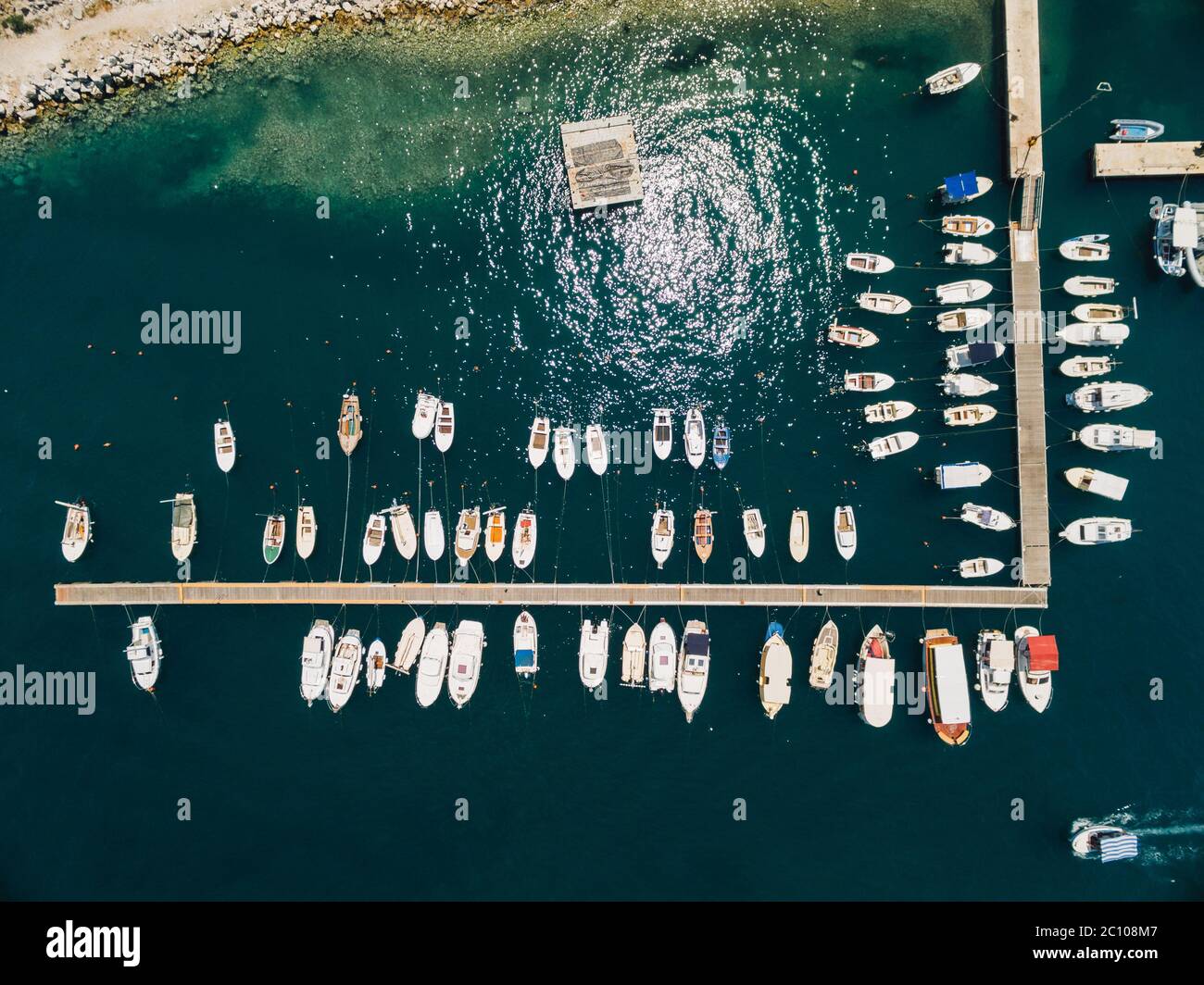 Boat dock and yacht port in Budva, Montenegro. Aerial photo from the ...