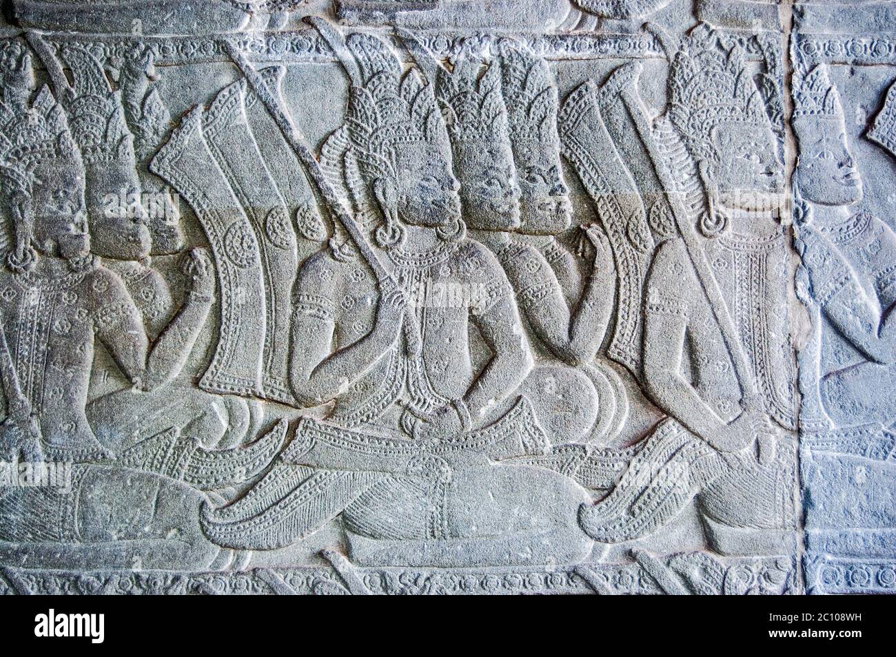 Kneeling demi-god soldiers in the Ramayana Hindu epic. Bas relief ...