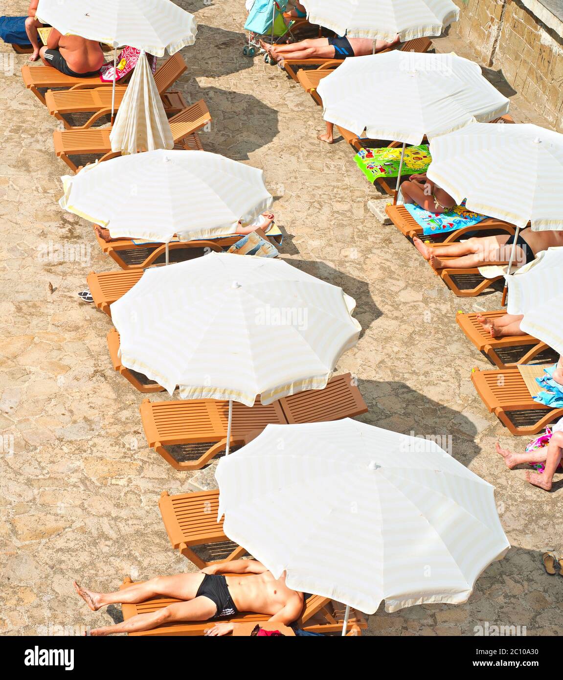Sunbath in a beach Stock Photo - Alamy