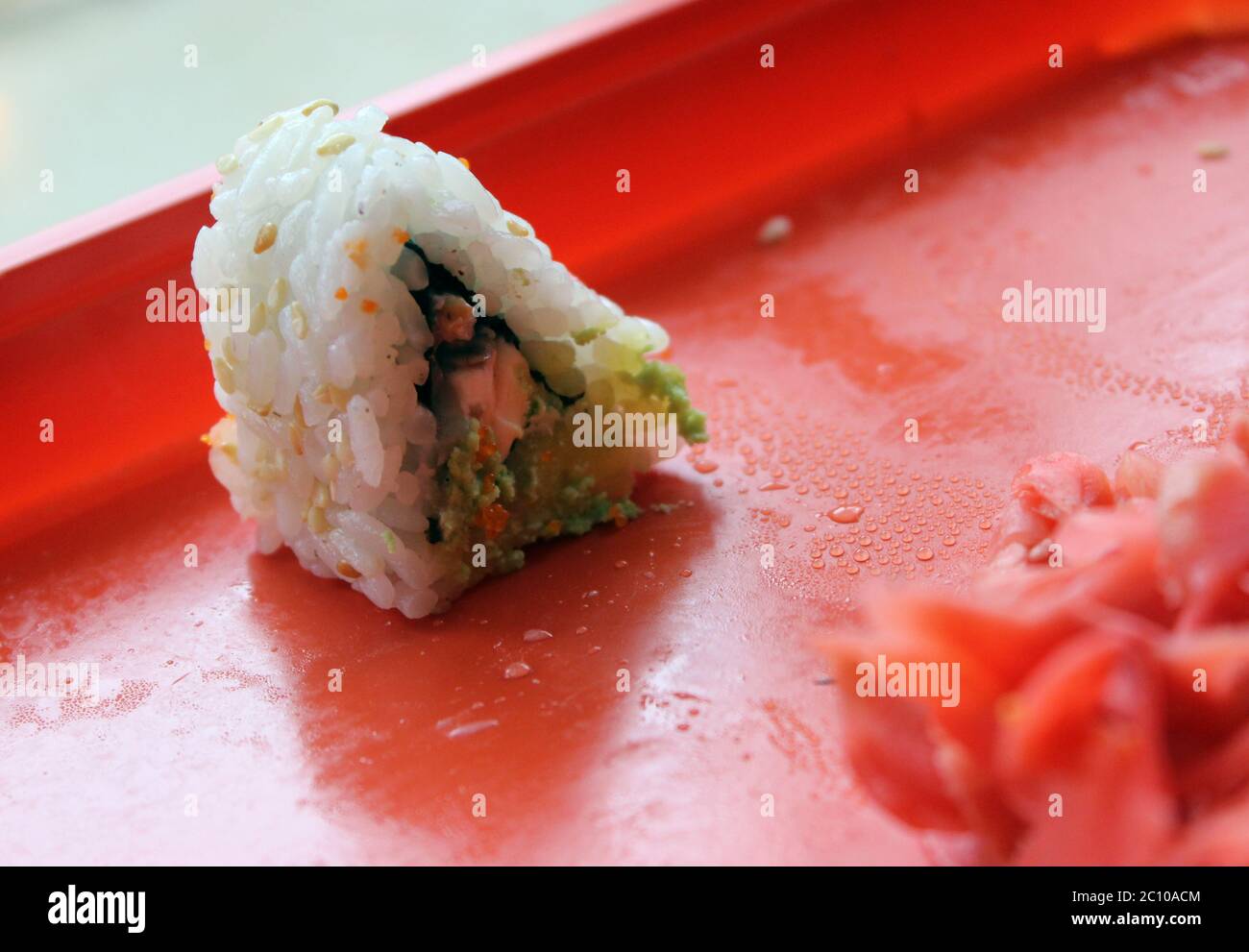 One triangular food Japanese Spicy Salmon Roll Stock Photo - Alamy