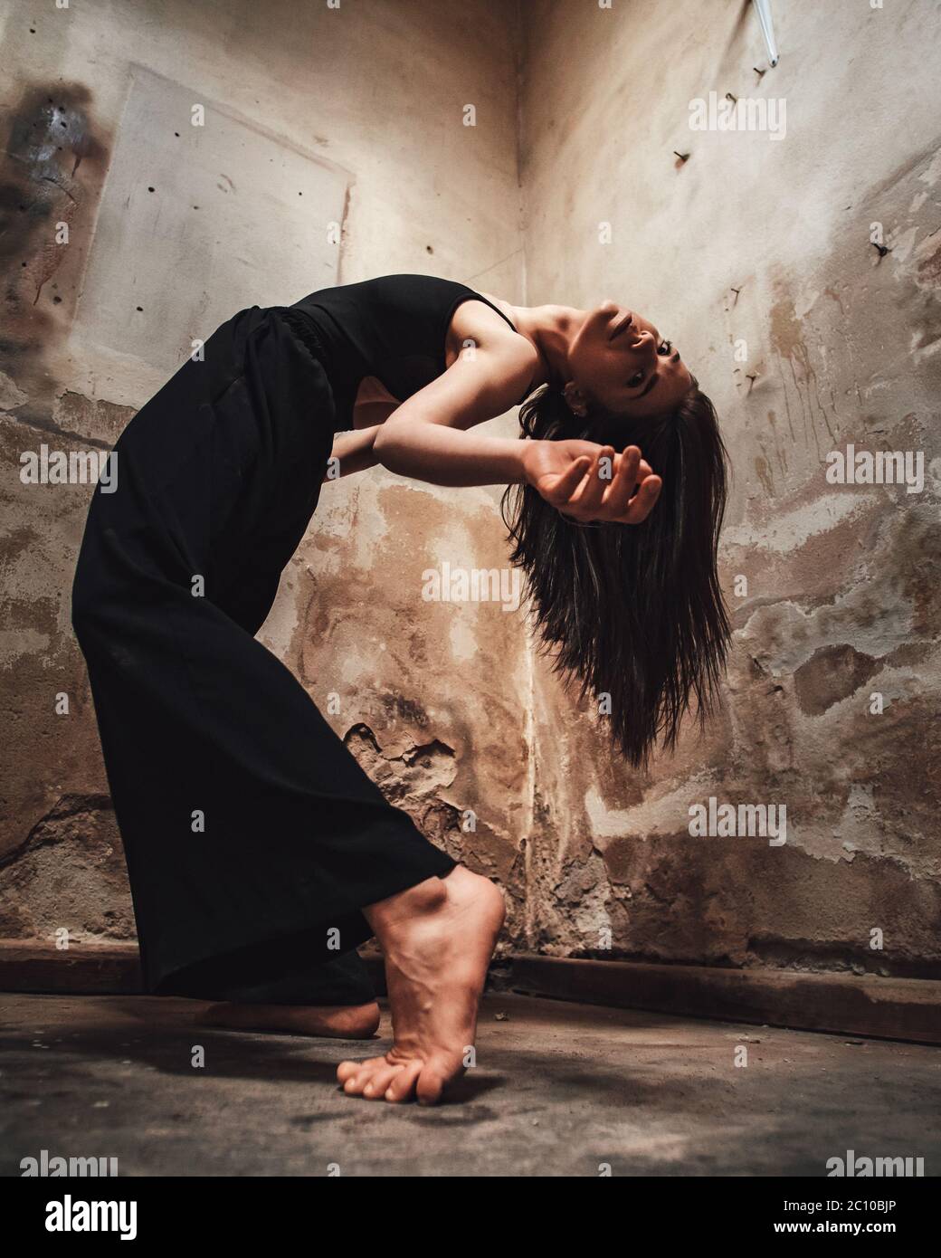 contemporary woman dancer backbend with long hair Stock Photo - Alamy