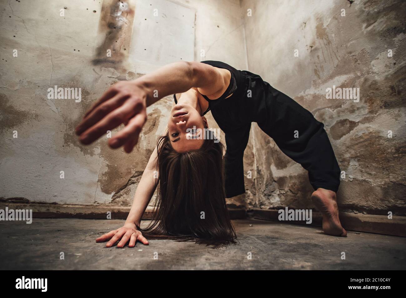 contemporary woman dancer reach out hand to camera Stock Photo - Alamy