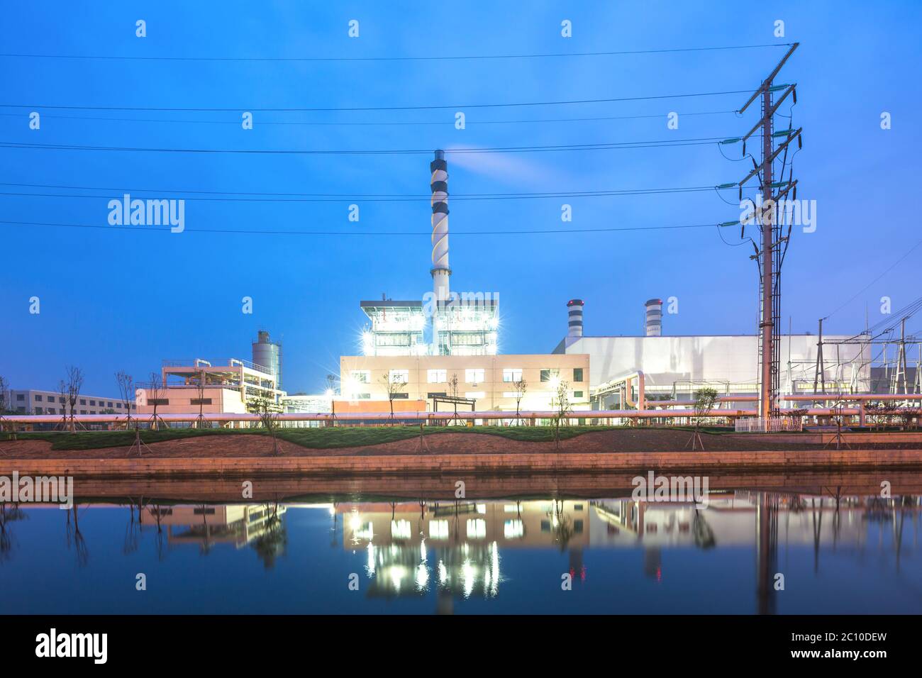 modern factory near river in blue sky at dawn Stock Photo - Alamy
